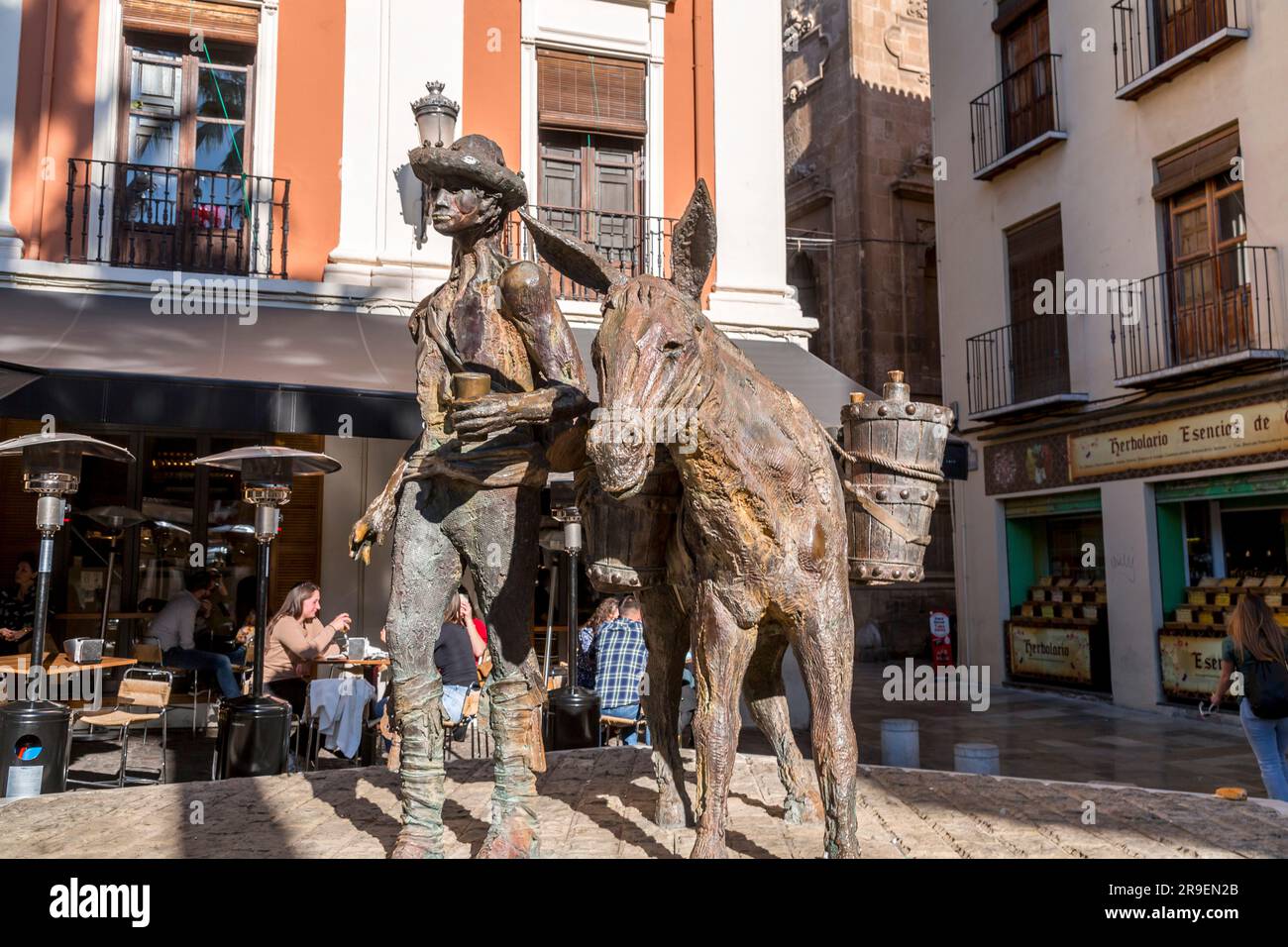 Granada, Spain - February 22, 2022: Bronze statue of a man and a mule ...