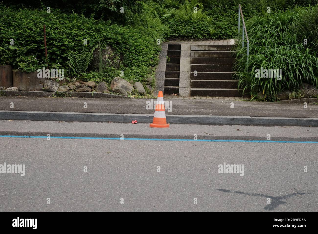 Safety first in construction zones. Workers in orange hard hats repair ...