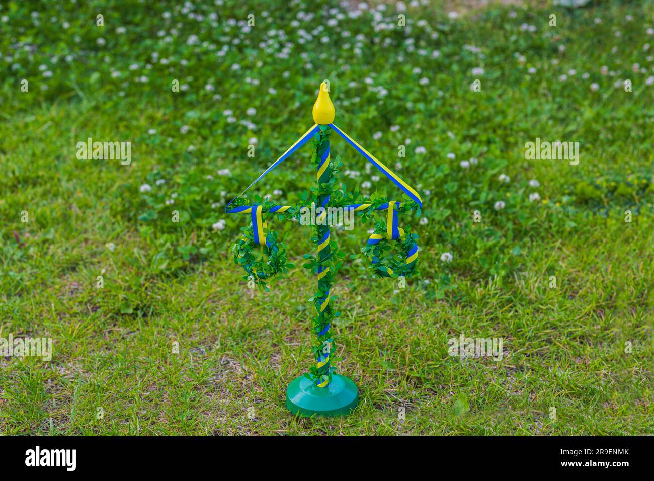 Traditional swedish table decoration for Midsummer holiday on green ...