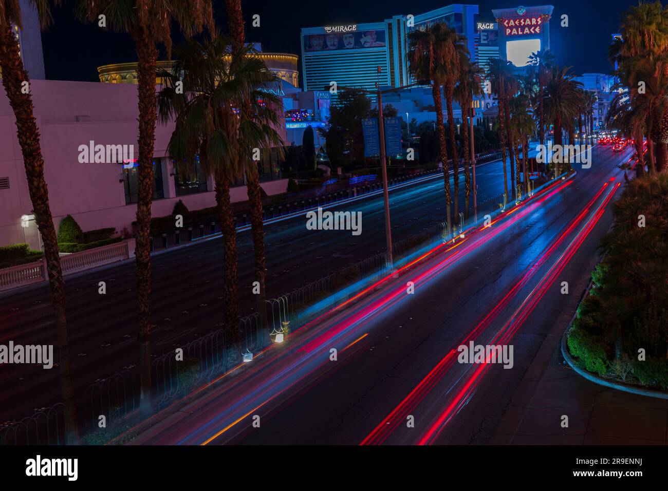 Night view of Las Vegas cityscape with gorgeous defocused light tracers of cars on Strip Road ...