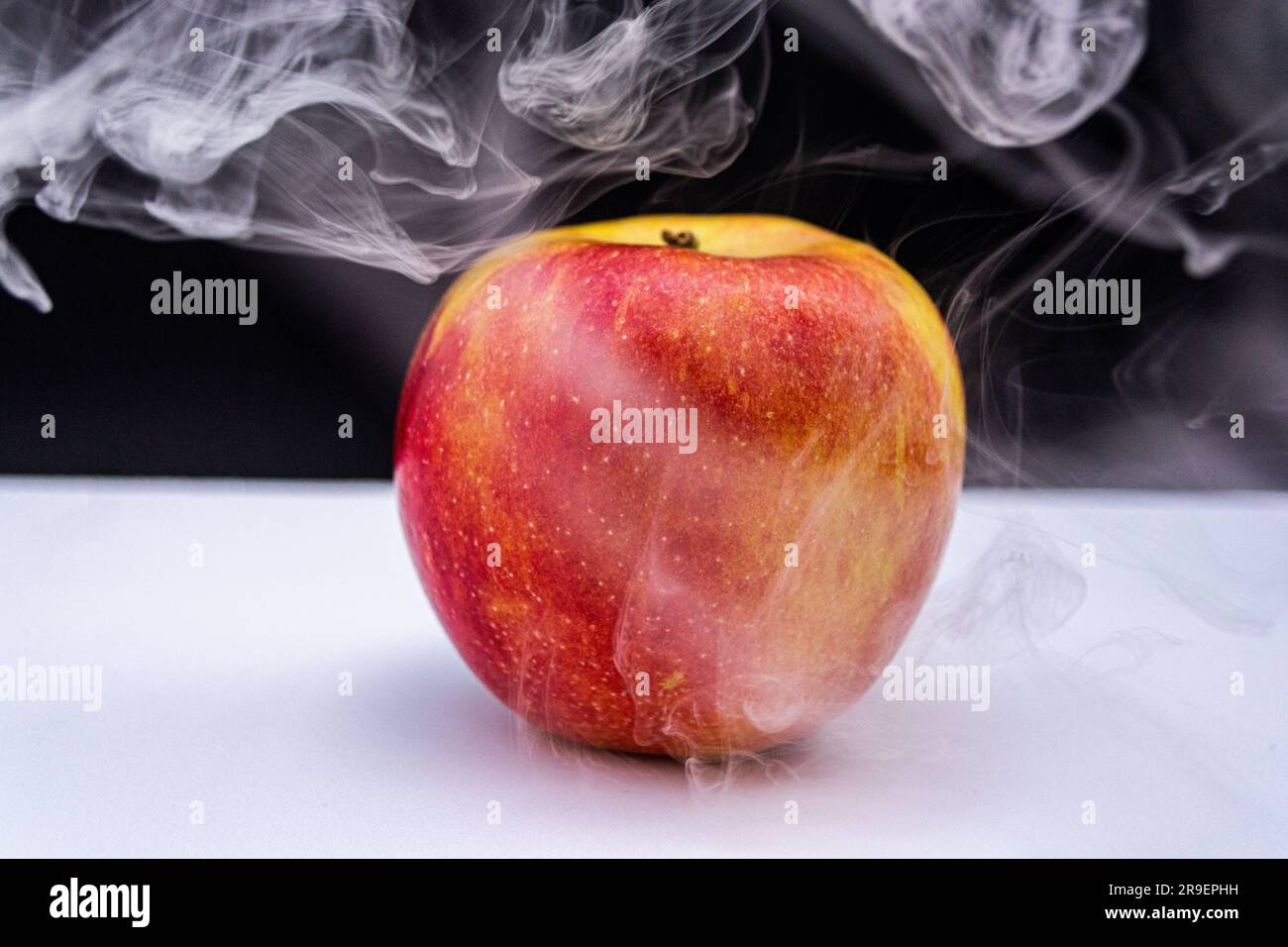 Apple with magical smoke, mystery apple on black and white Stock Photo ...