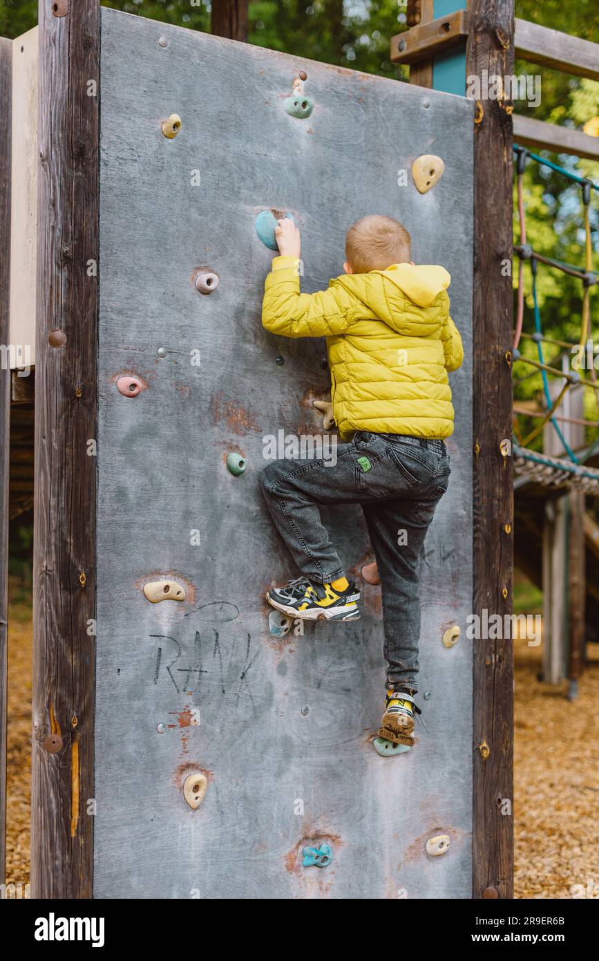 Boy At The Climbing Wall Without A Helmet, Danger At The Climbing Wall ...