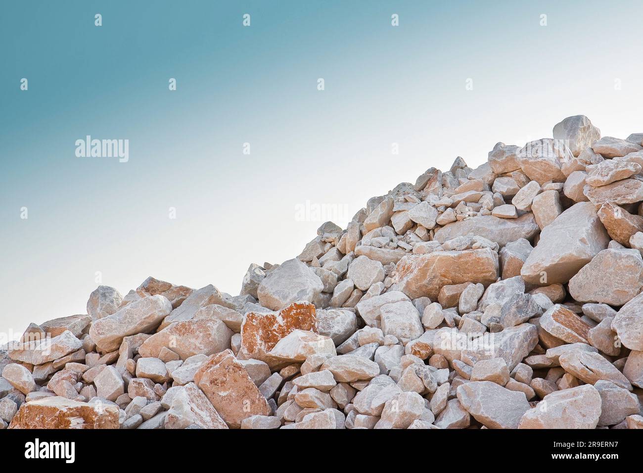 Pile of gravel, stones and cliffs of different sizes on white ...