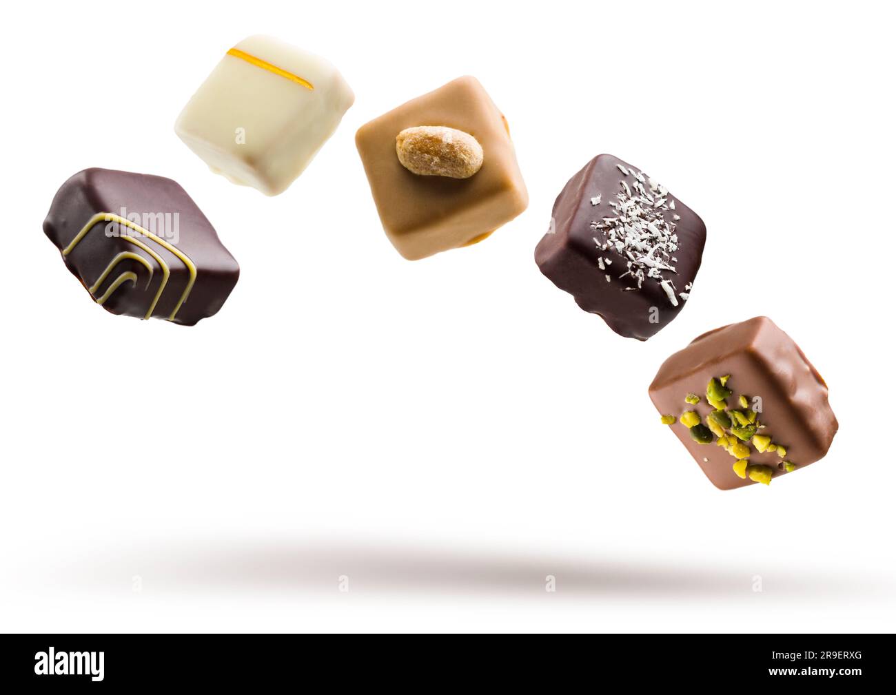 Assorted chocolate pralines floating on white background Stock Photo ...