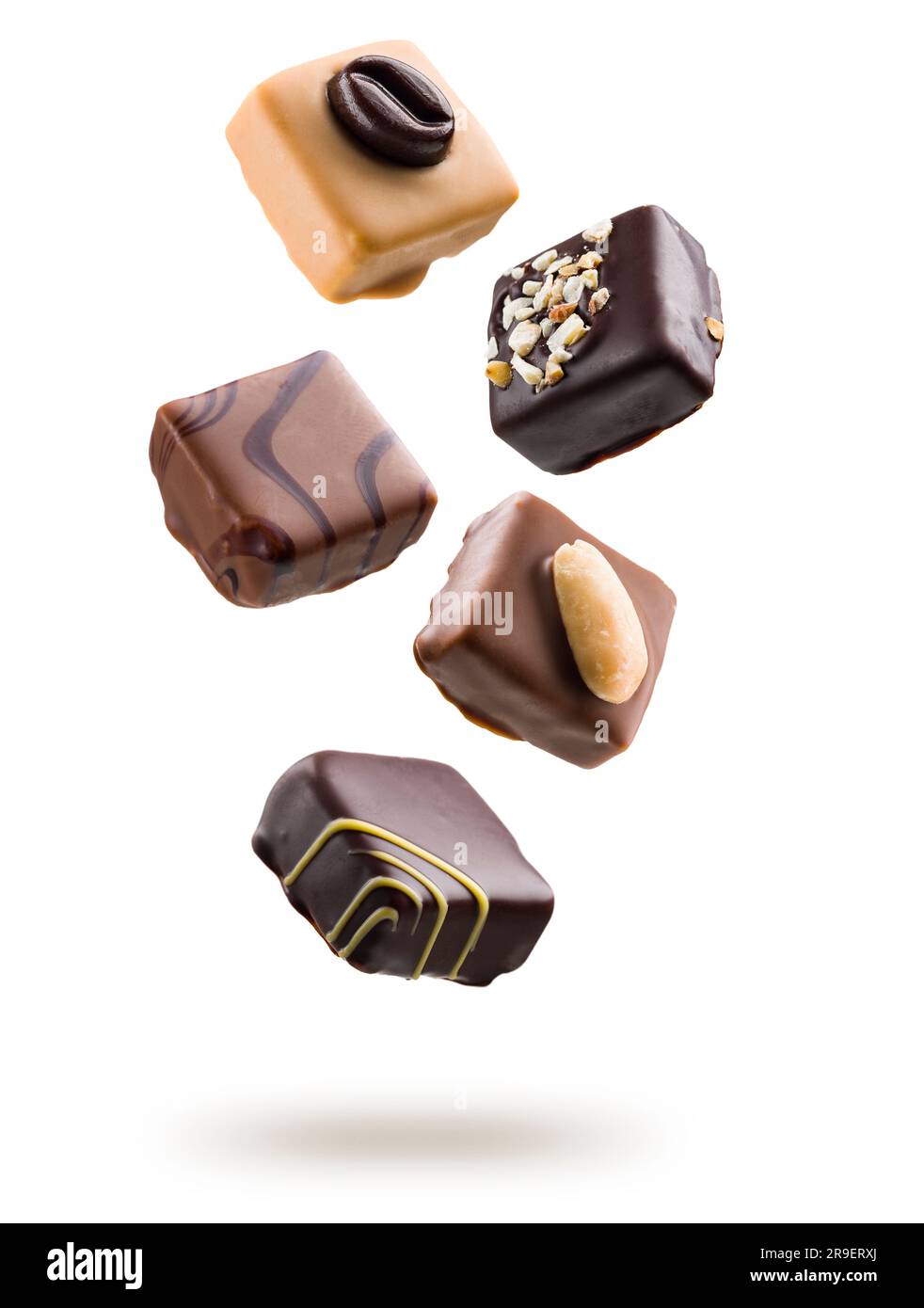 Assorted chocolate pralines floating on white background Stock Photo ...