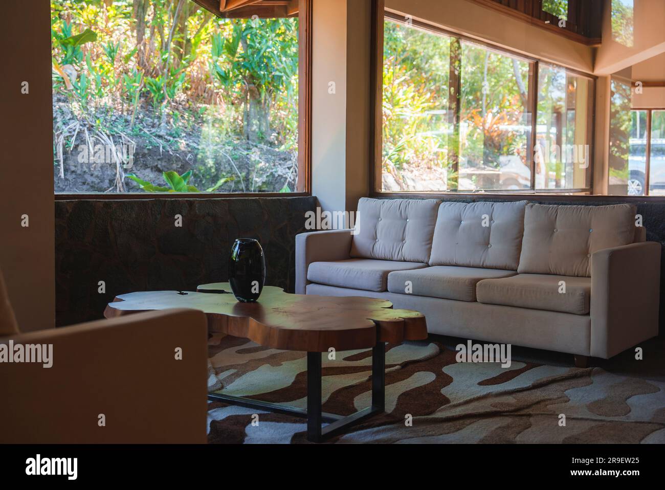 Living room with jungle view hi-res stock photography and images - Alamy