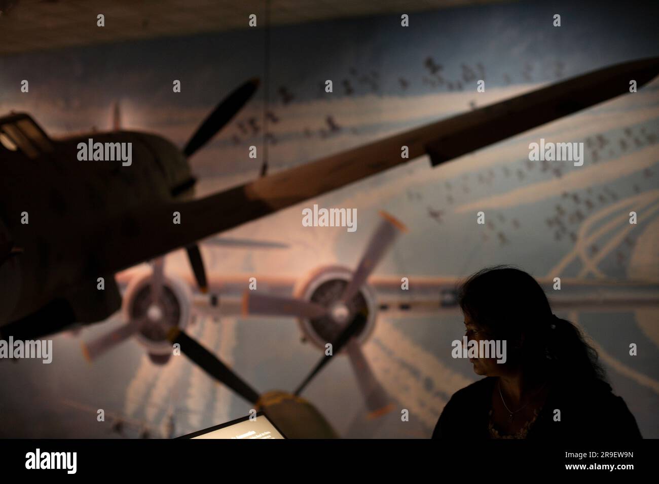 A Visitor To The National Air And Space Museum Watching An Aircraft