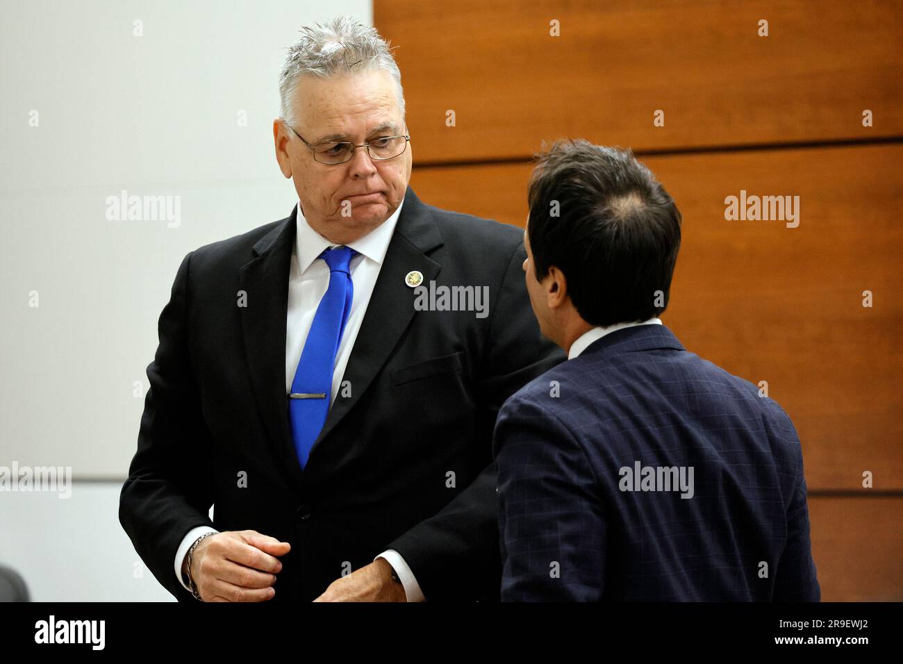 Defense attorney Mark Eiglarsh, right, speaks to his client former ...