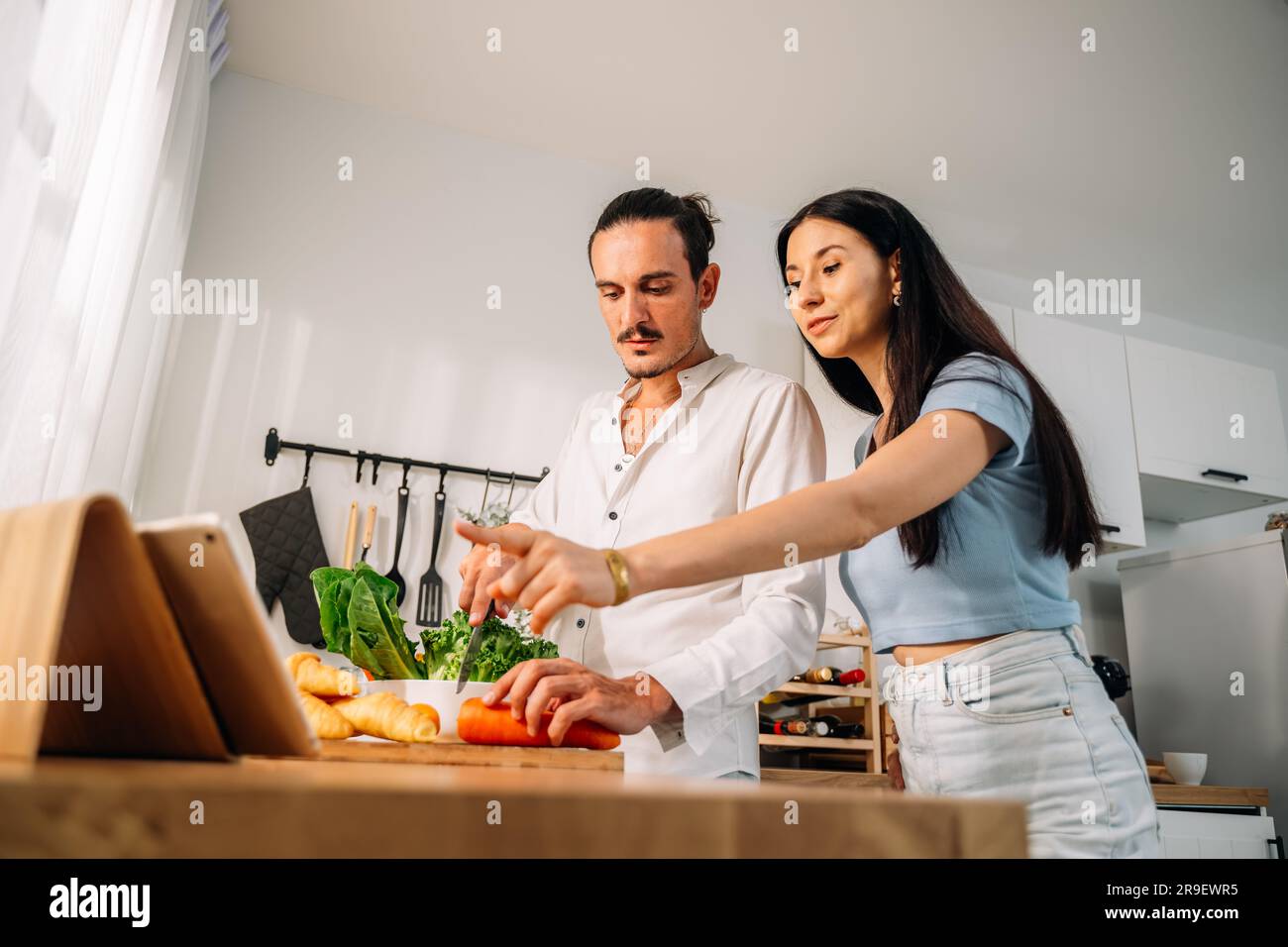 Healthy lovers cooking food in kitchen, Couple spending time together ...