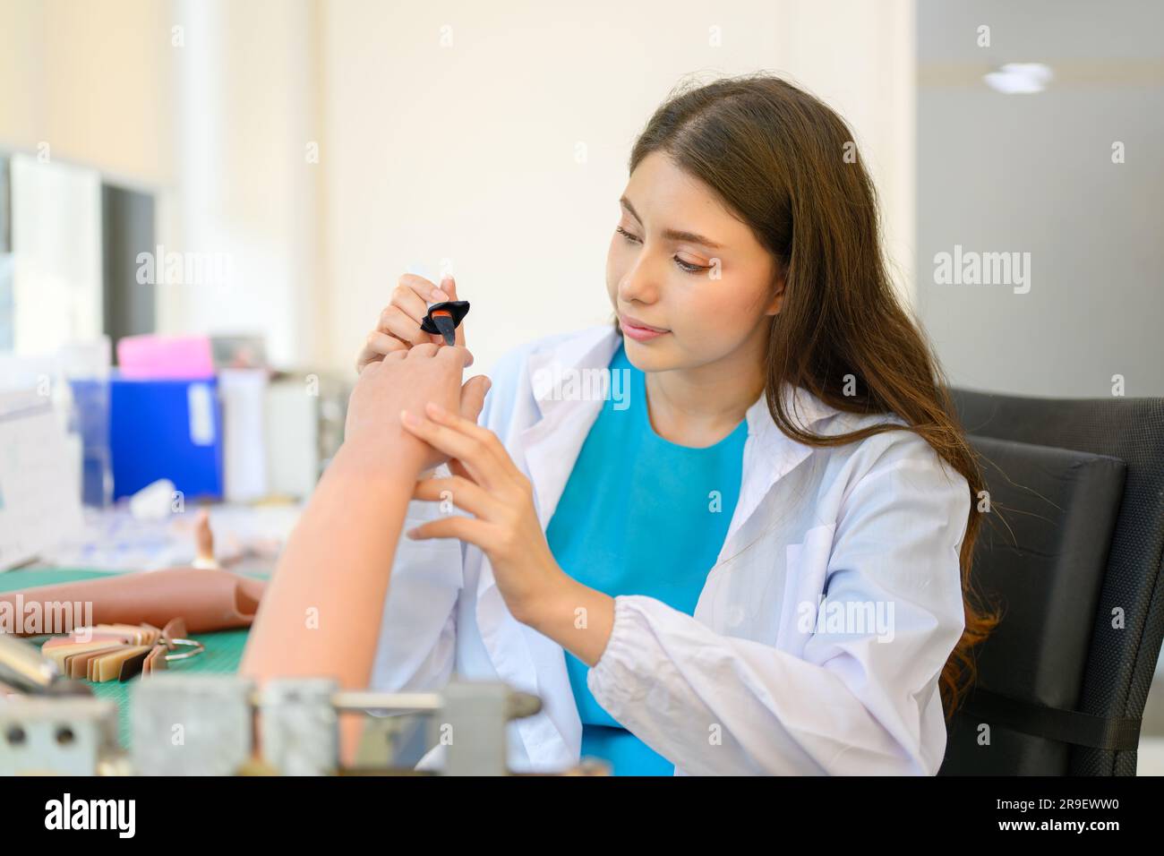 Technician making prosthetic limb device at laboratory Stock Photo - Alamy