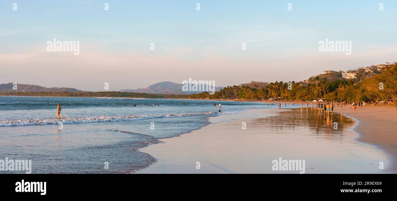 Tourists spending leisure time at the beach Stock Photo - Alamy