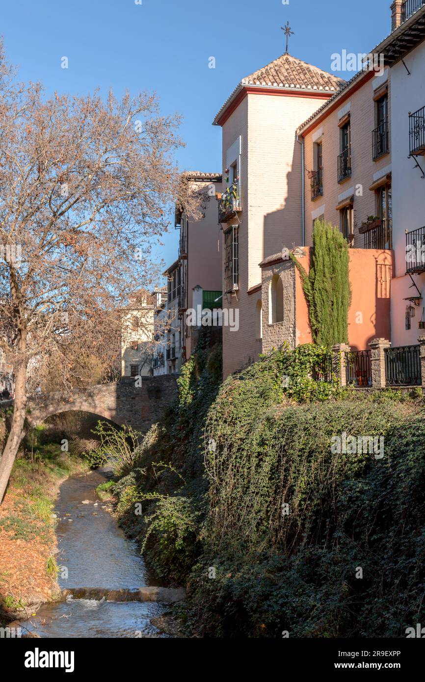 The stone bridge and traditional moorish Spanish architecture around ...