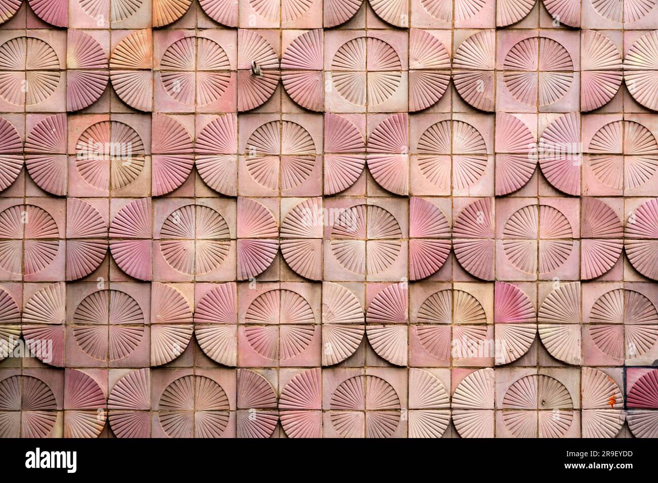 Mid-century modern style tiled wall with half circle decorations ...