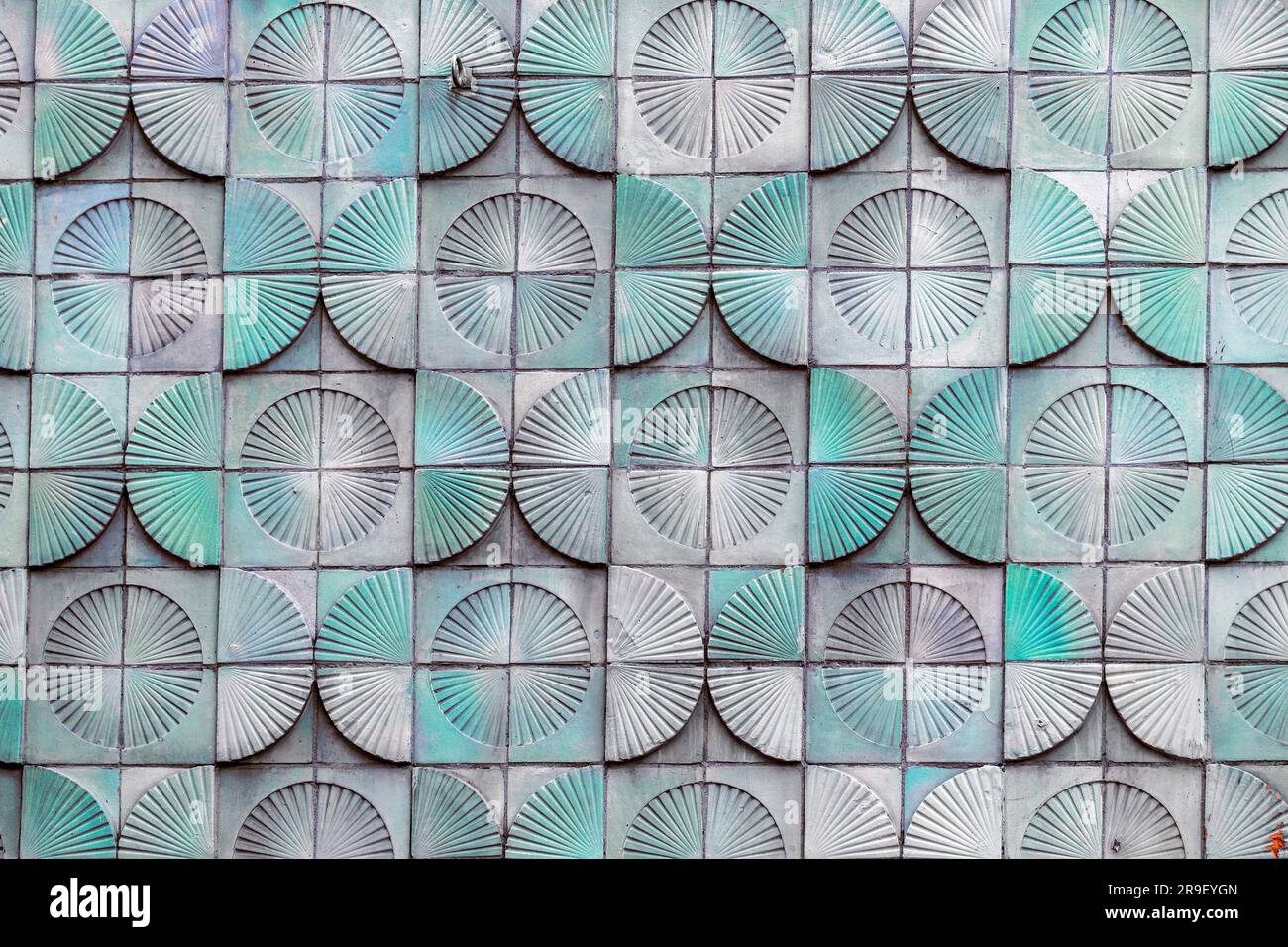 Mid-century modern style tiled wall with half circle decorations ...