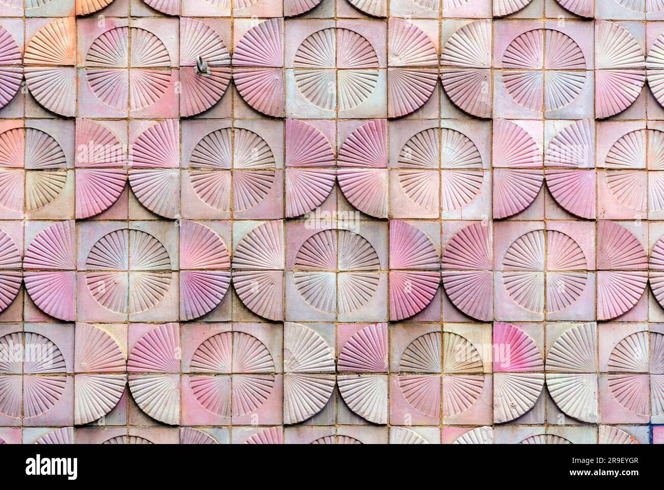 Mid-century modern style tiled wall with half circle decorations ...