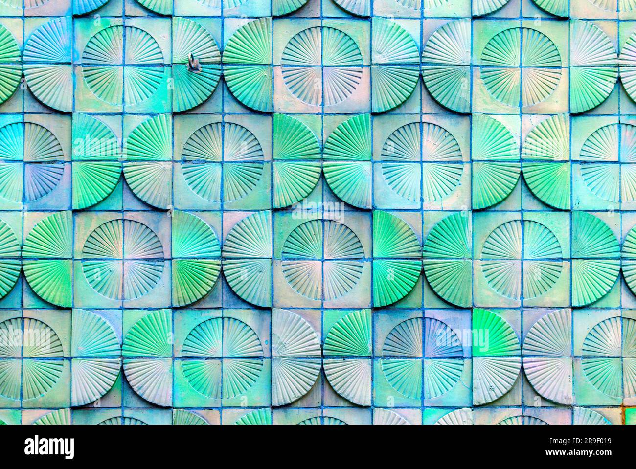 Mid-century modern style tiled wall with half circle decorations ...