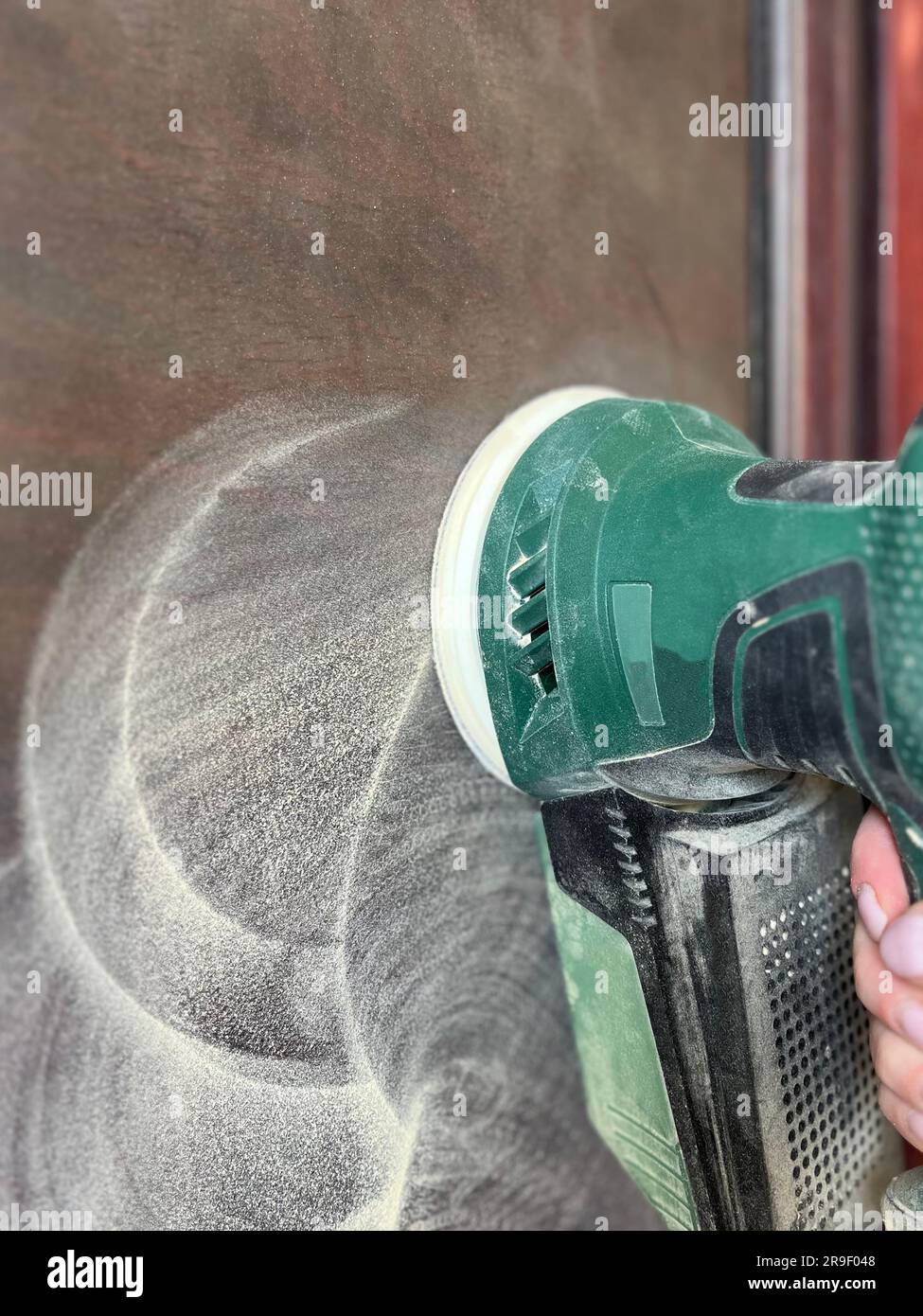 Restoration of old furniture with sander machine Stock Photo - Alamy