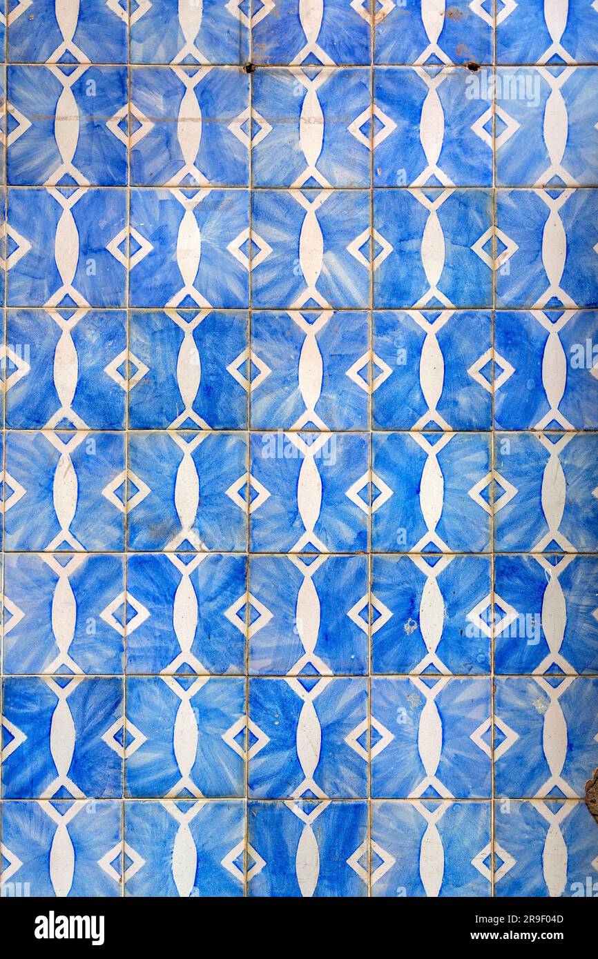 Fragment of Andalusian glazed ceramic tiled wall close up texture ...