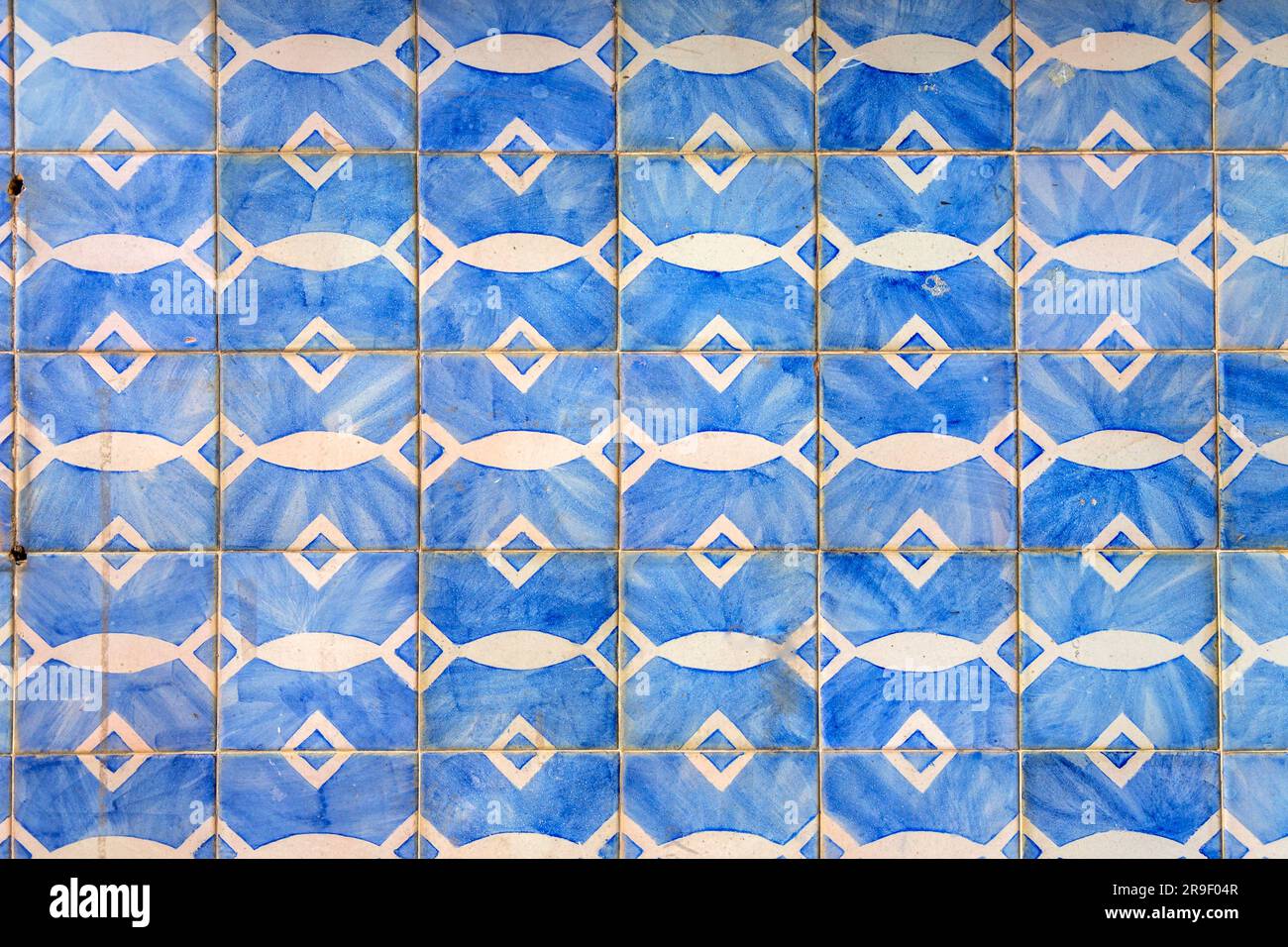 Fragment of Andalusian glazed ceramic tiled wall close up texture ...