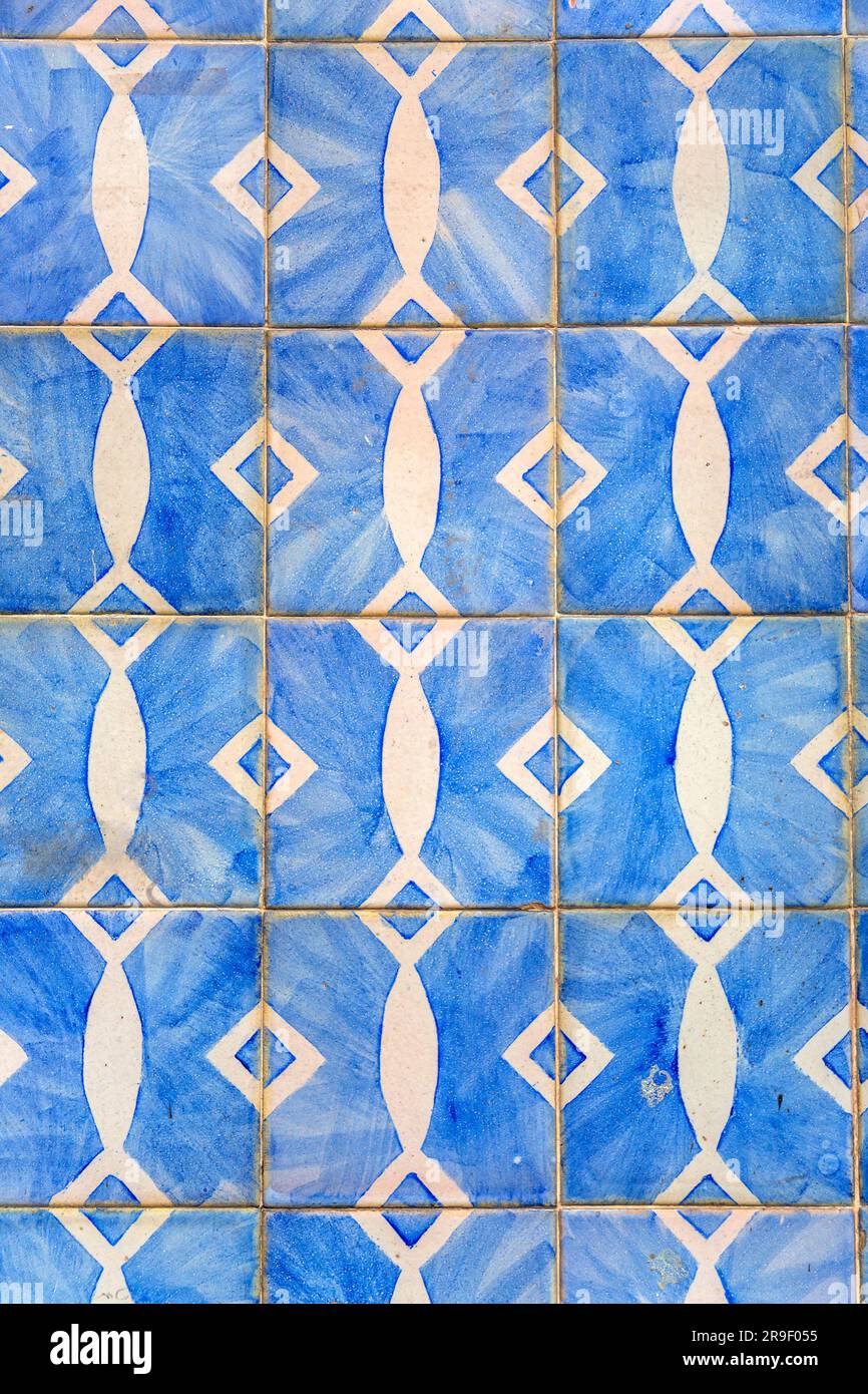Fragment of Andalusian glazed ceramic tiled wall close up texture ...
