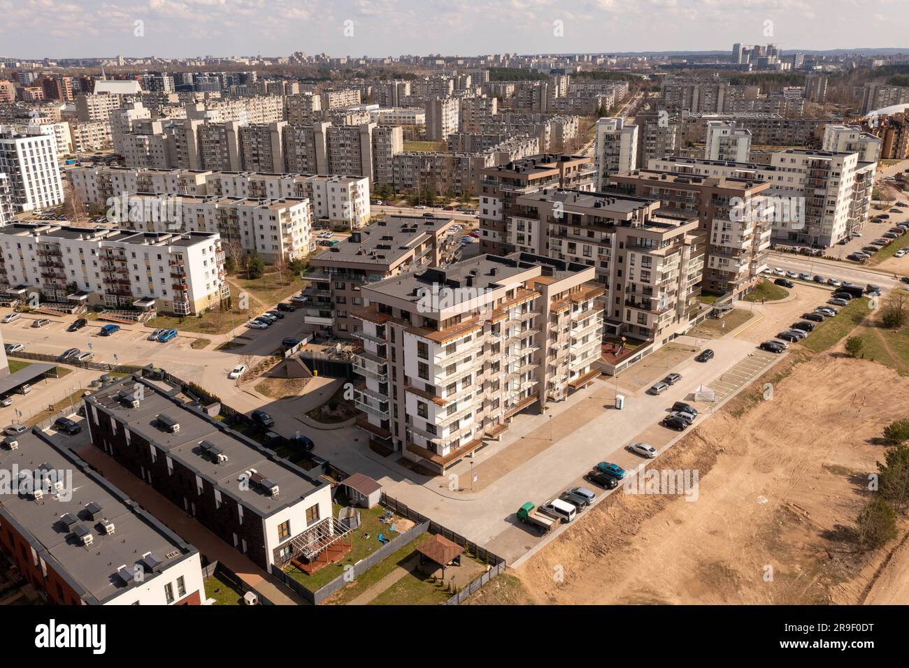 Drone photography of new housing spread in suburbs and old high rise ...