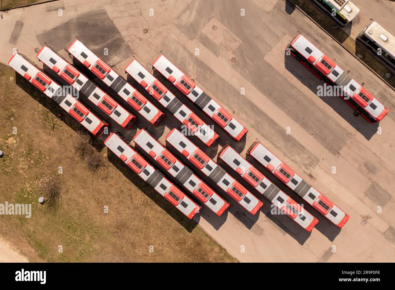 Drone photography of bus parking lot and lot of buses in a line during ...