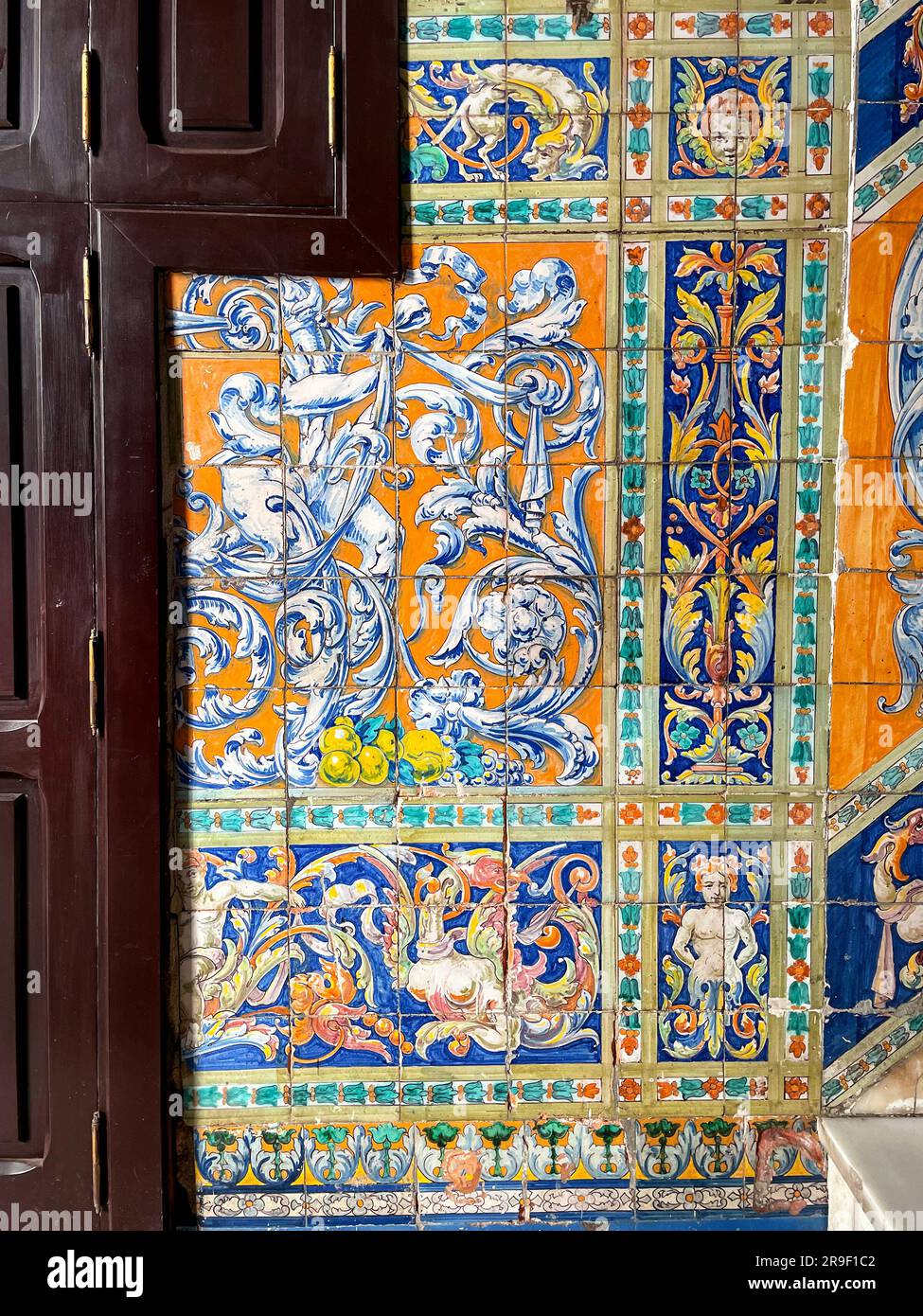 Fragment of Andalusian glazed ceramic tiled wall close up texture ...