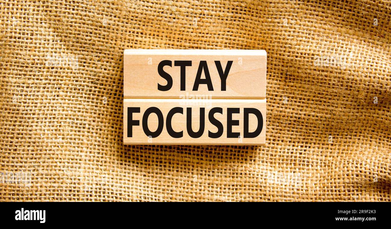 Stay focused symbol. Concept words Stay focused on wooden blocks on a ...