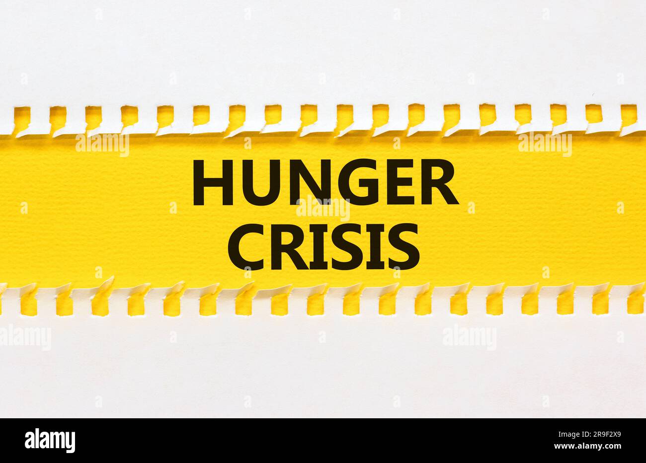 Hunger crisis symbol. Concept words Hunger crisis on beautiful yellow ...