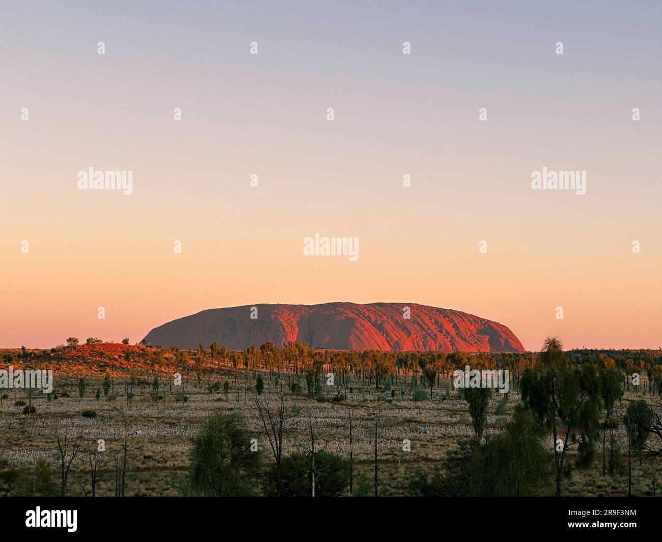 A scenic view of the iconic Uluru Rock in Australia's Northern ...