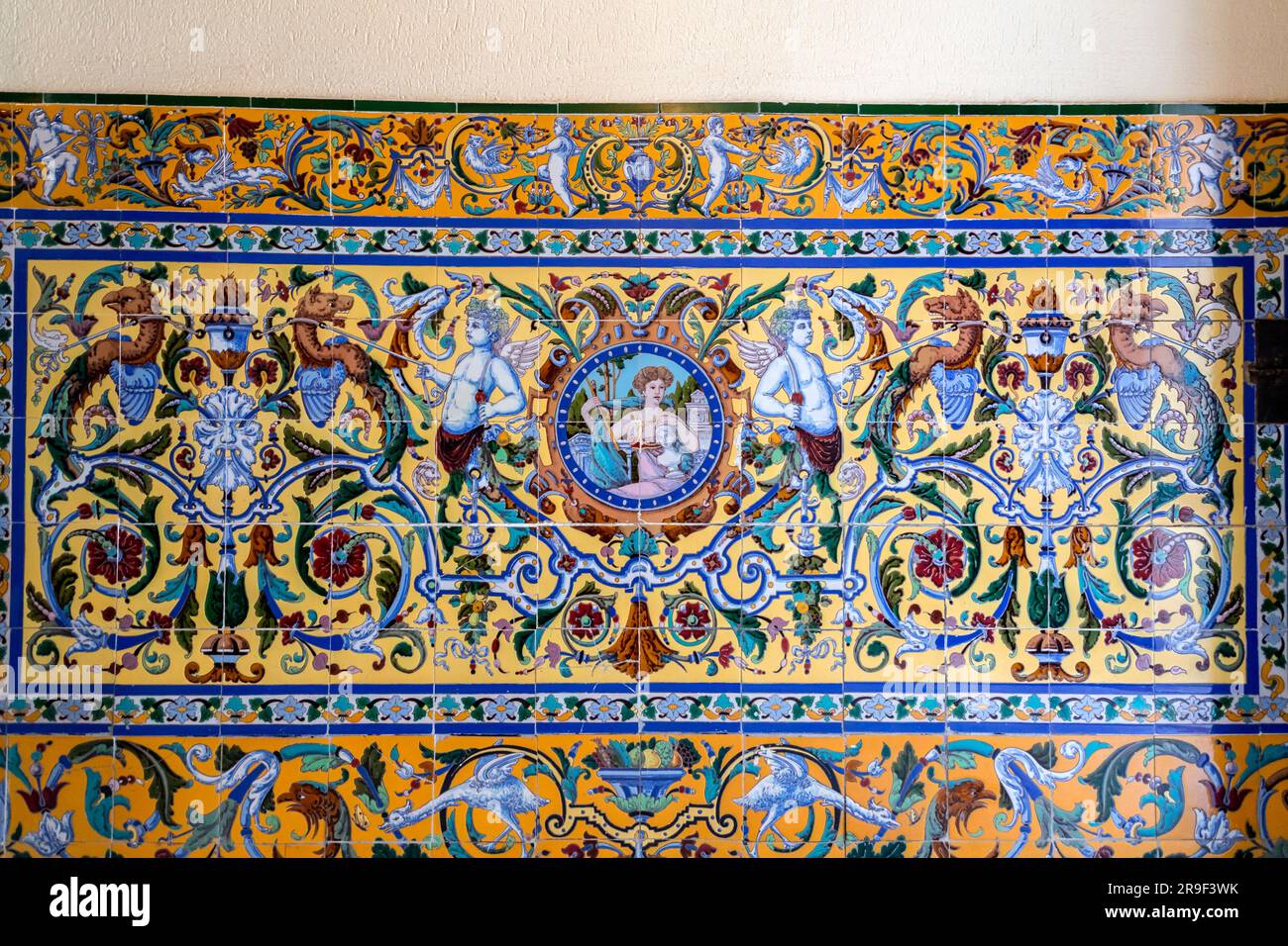 Fragment of Andalusian glazed ceramic tiled wall close up texture ...