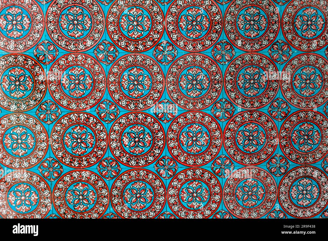 Fragment of Andalusian glazed ceramic tiled wall close up texture ...