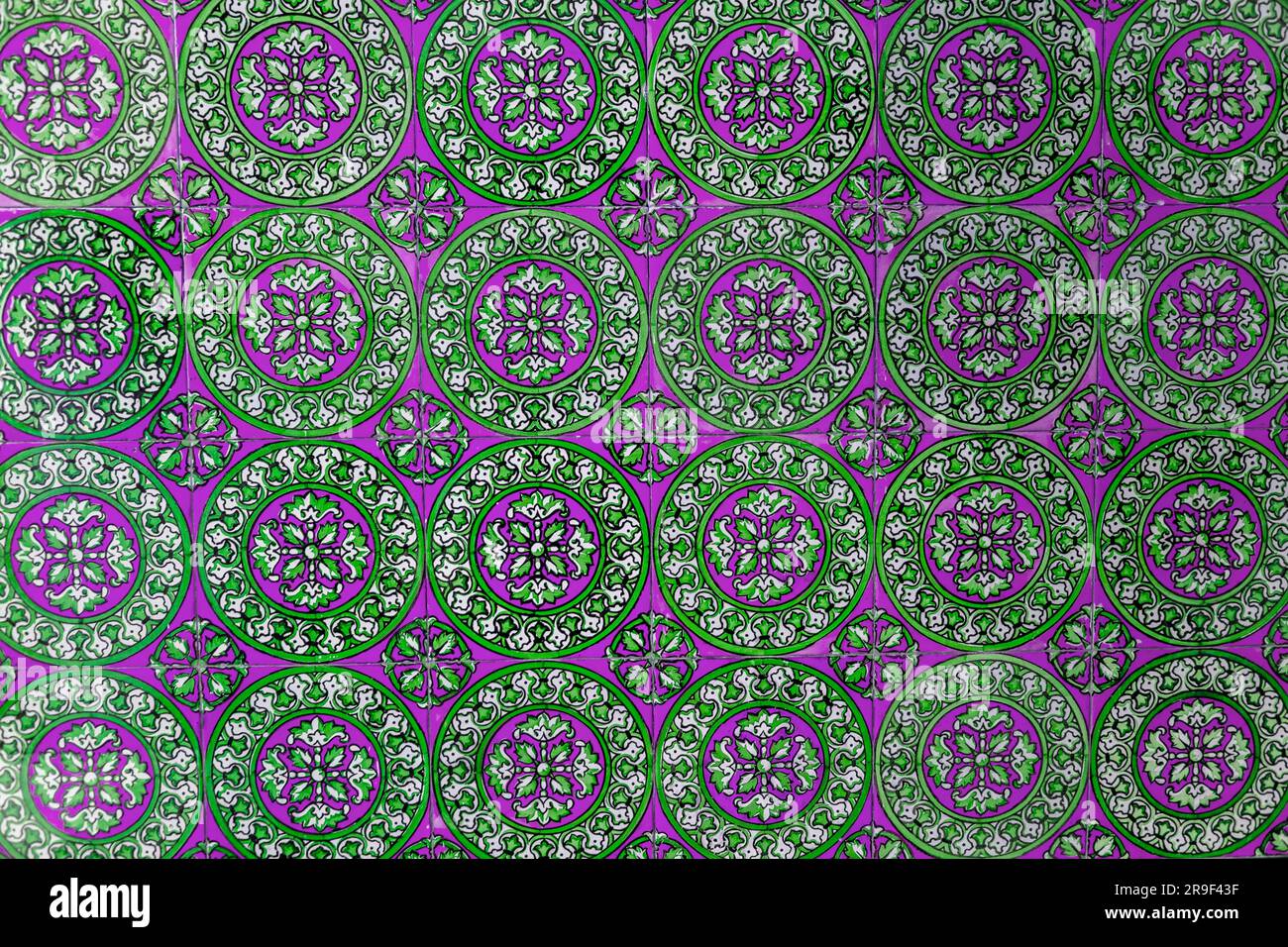 Fragment of Andalusian glazed ceramic tiled wall close up texture ...