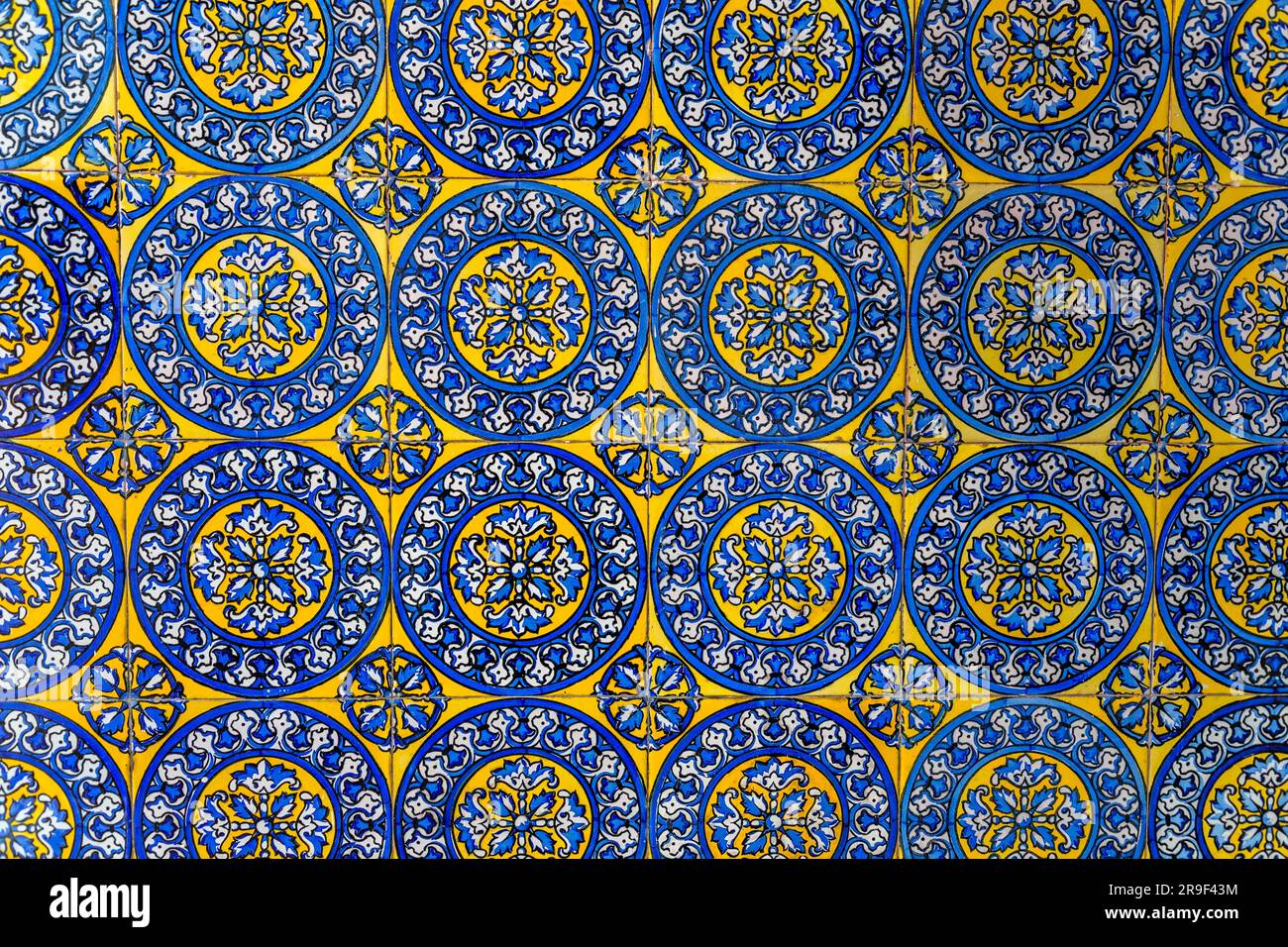 Fragment of Andalusian glazed ceramic tiled wall close up texture ...