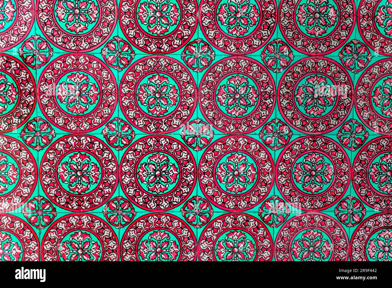 Fragment of Andalusian glazed ceramic tiled wall close up texture ...