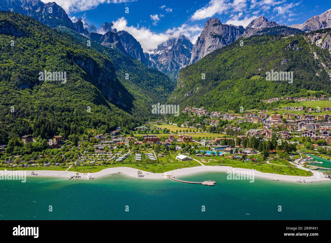 An aerial view of Lago di Molveno, Italy, with the mountains and a ...