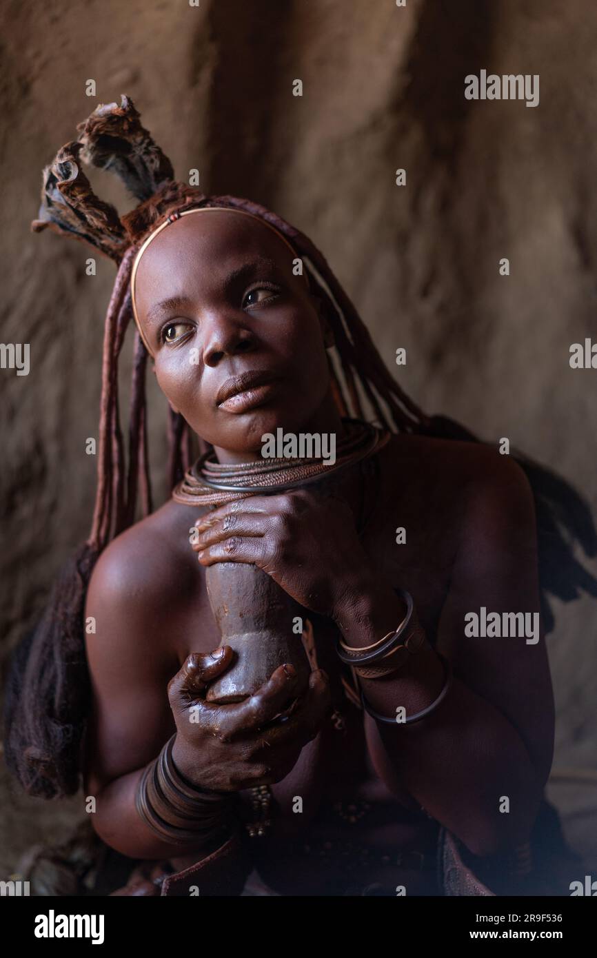 Himba woman inside her hut in a traditional Himba village near Kamanjab in Namibia, Africa Stock ...