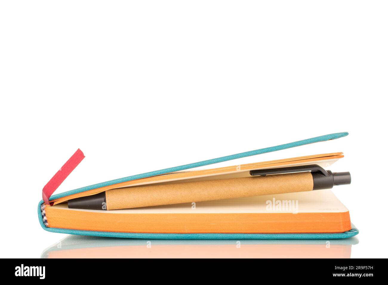 One notebook with pen, macro, isolated on white background Stock Photo ...