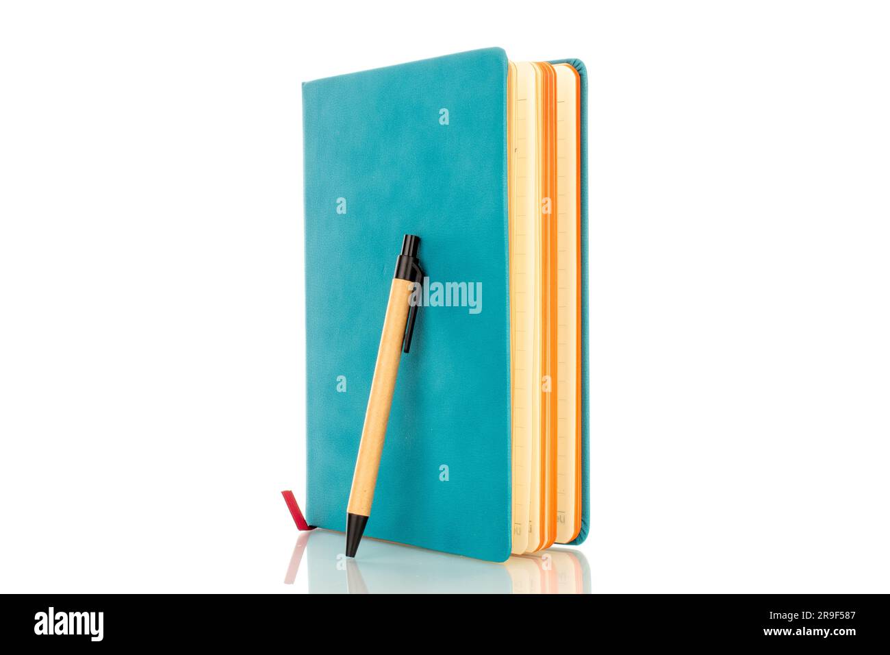 One notebook with pen, macro, isolated on white background Stock Photo ...