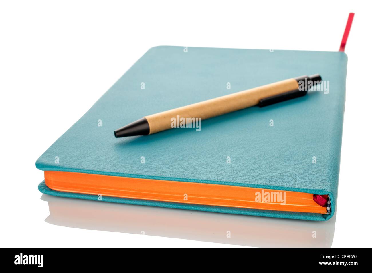 One notebook with pen, macro, isolated on white background Stock Photo ...