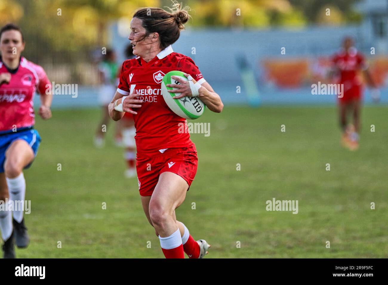 A group of female Canadian rugby players competing in the Rugby Sevens ...