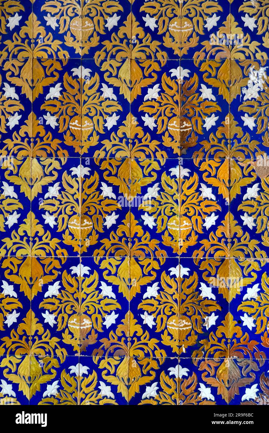 Fragment of Andalusian glazed ceramic tiled wall close up texture ...