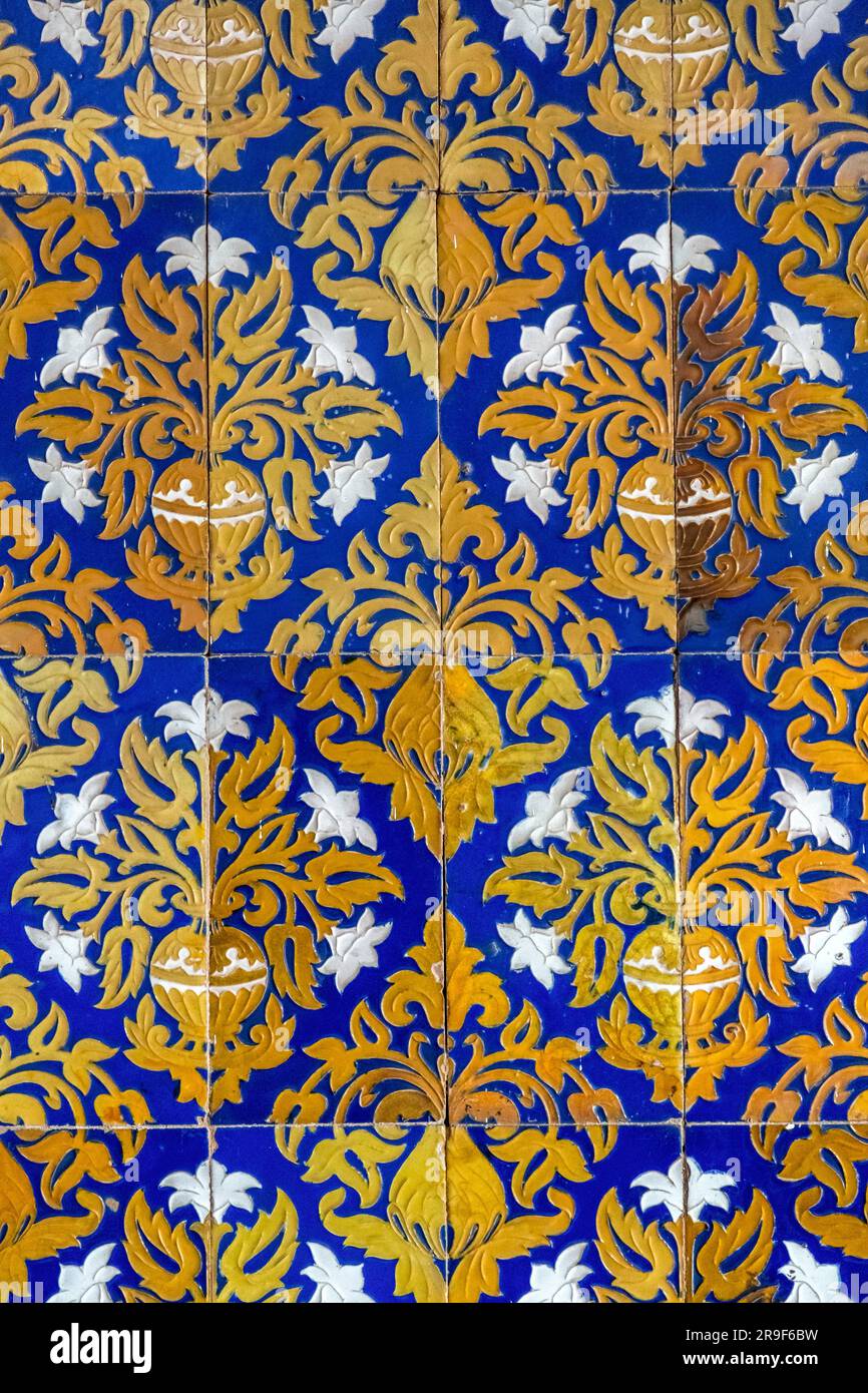 Fragment of Andalusian glazed ceramic tiled wall close up texture ...