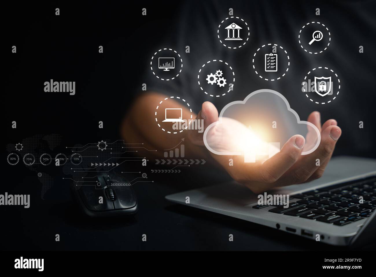 Man holding a laptop displaying cloud computing diagram with financial analytics Stock Photo - Alamy