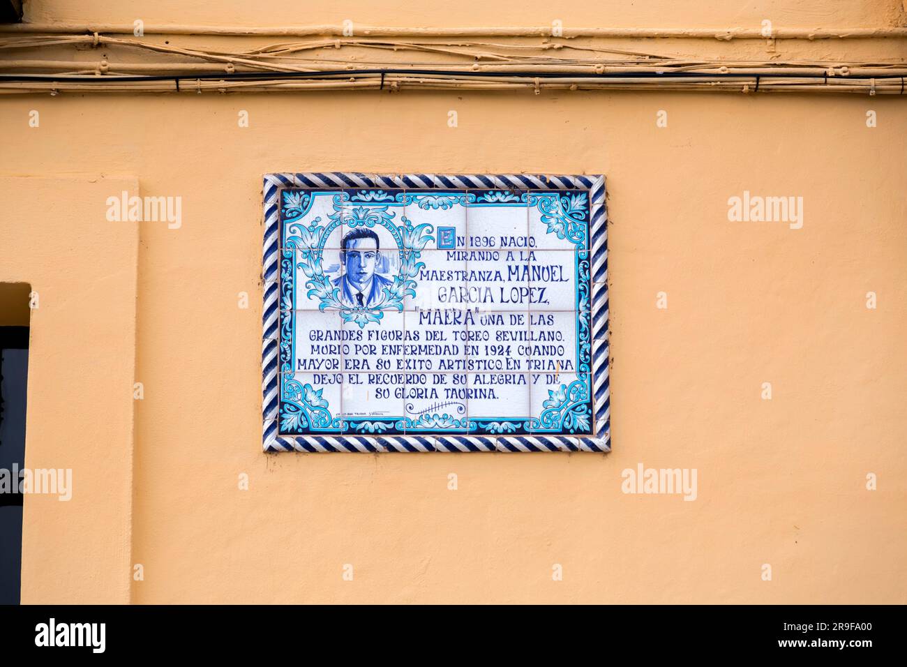 Seville, Spain-FEB 24, 2022: Ceramic tile sign commemorating the ...