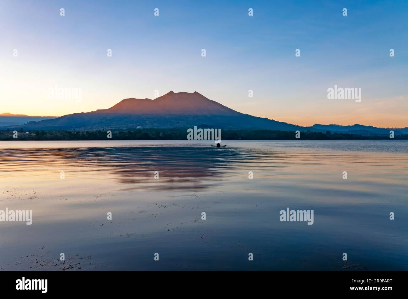 Sunrise over Mt Batur volcano sky Bali Indonesia Stock Photo - Alamy