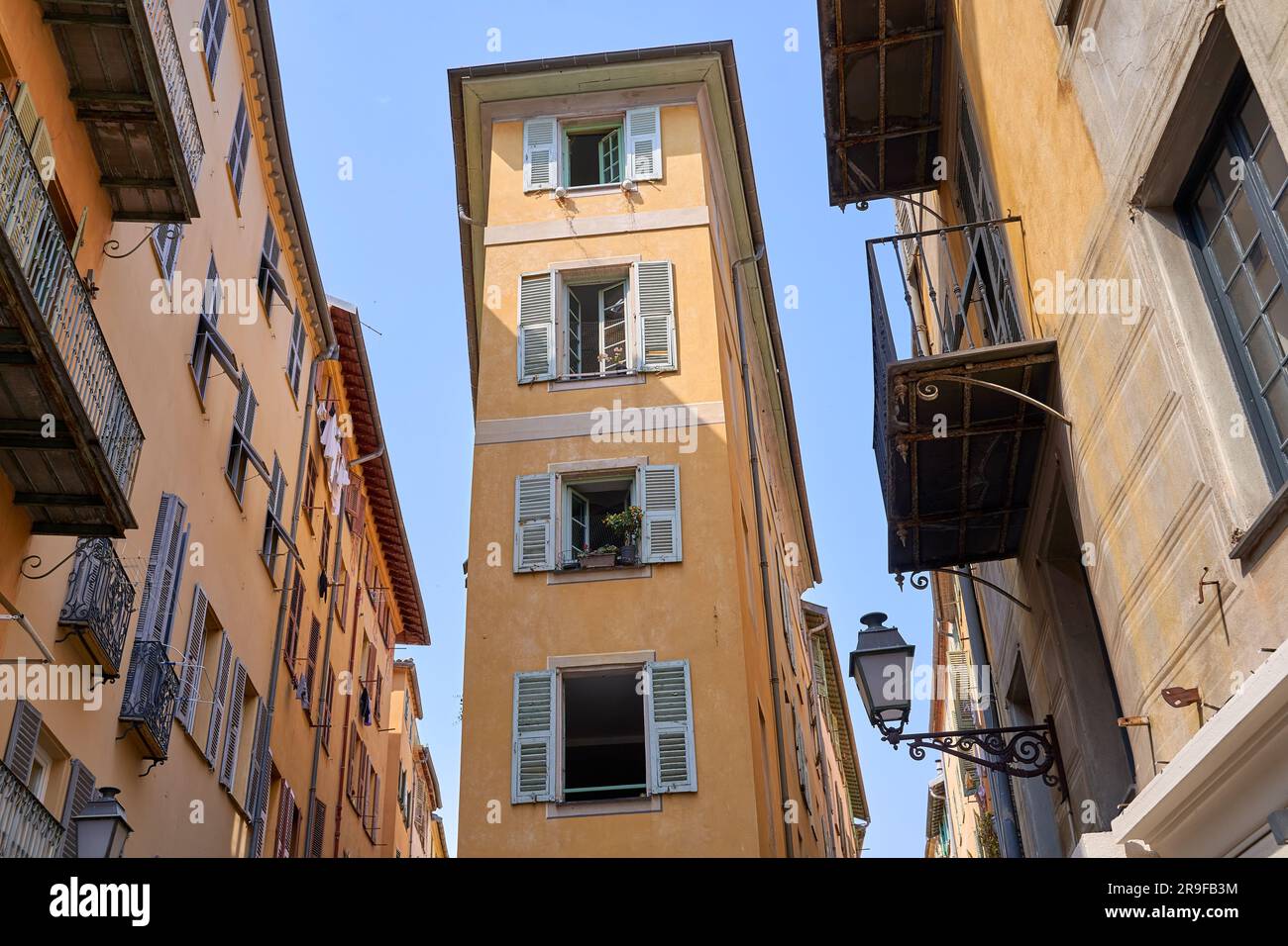 Old Town of Nice city in France, narrow apartment building with ...