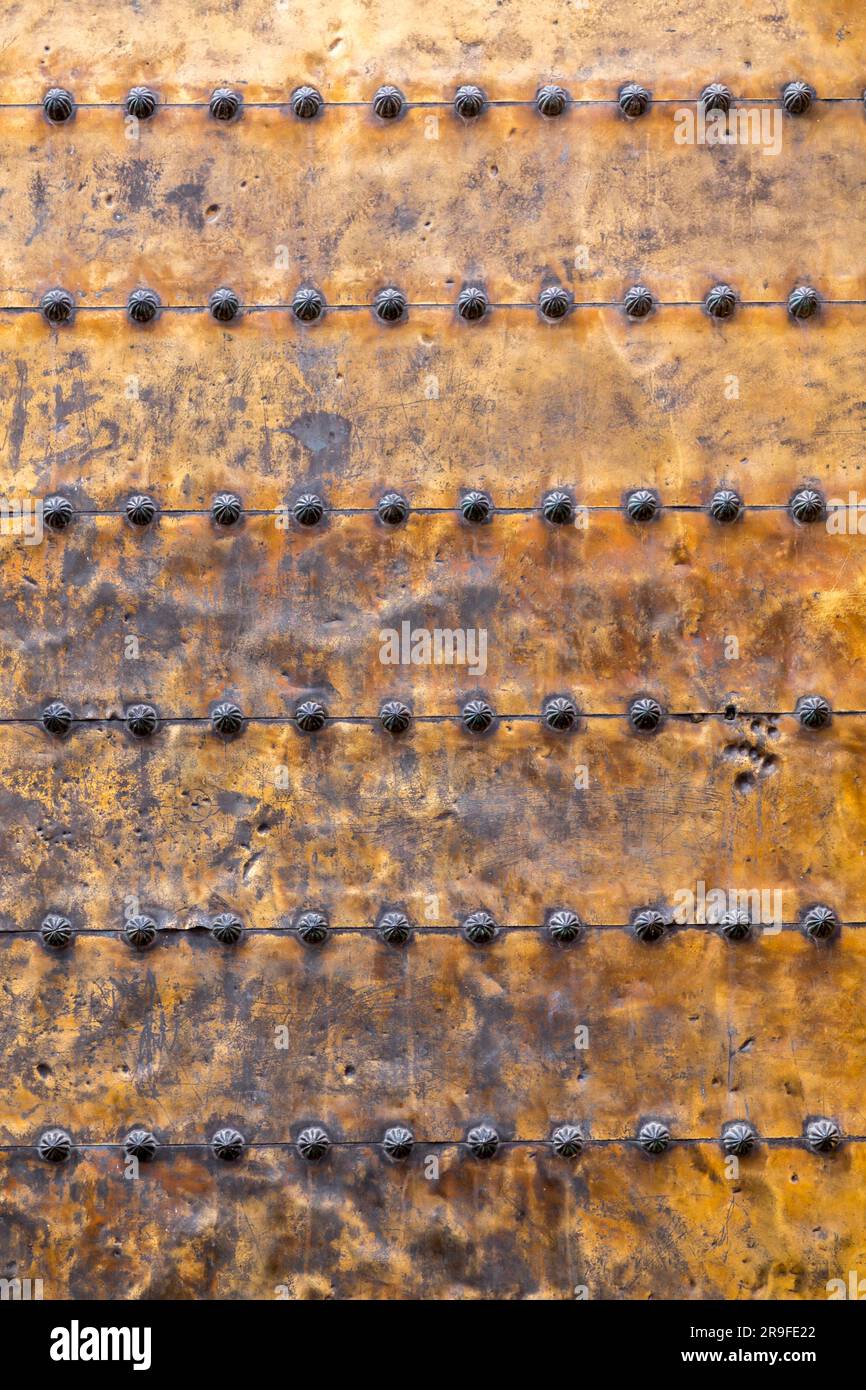 Ancient run-down copper door texture background with scratches and ...