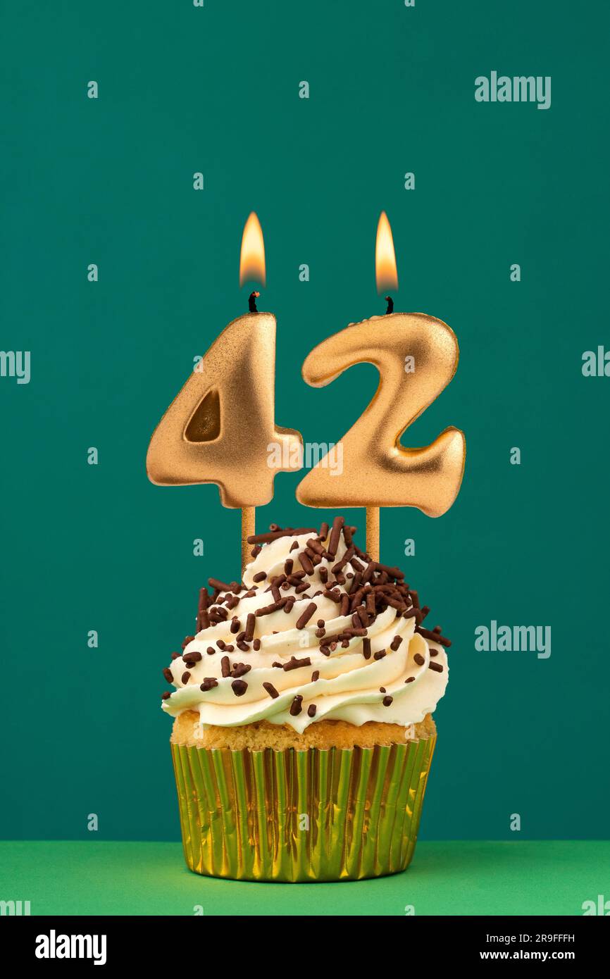 Birthday card with candle number 42 - Green background Stock Photo - Alamy