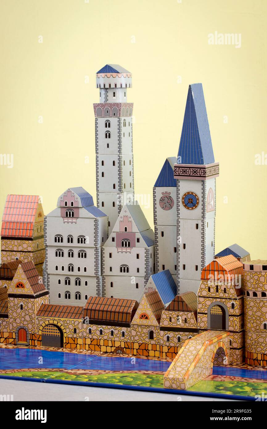 Colorful and cute medieval town from building blocks. Toy constructor ...